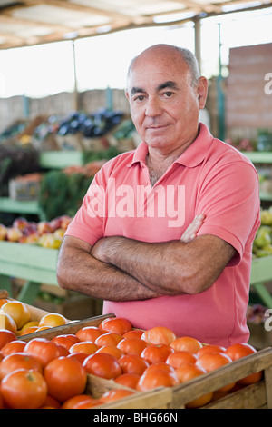 Market stall trader working his fruit & vegetable licensed stall pitch ...