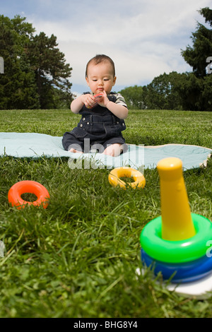 Asian baby boy holding toy block Stock Photo - Alamy