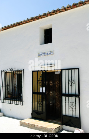 Empty restaurant in the mountains in Spain, outside the window is fog ...