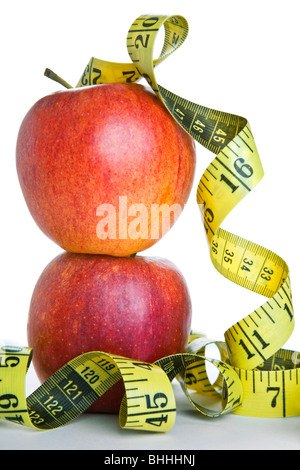 Red apples with a yellow tape-measure Stock Photo - Alamy