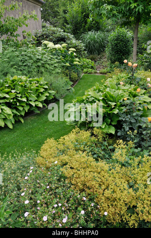 Perennial borders with grass path Stock Photo - Alamy