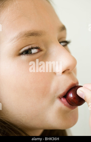 cropped view of kid hold cherry bowl on yellow background. copy space ...