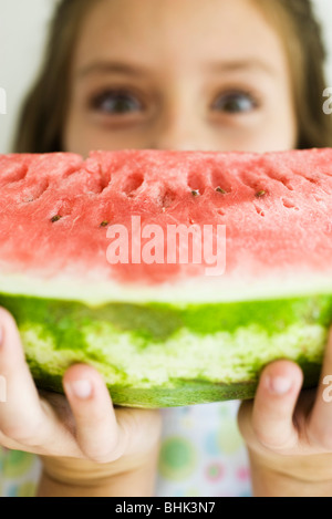 Kids face with watermelon, close up. Funny kid eating watermelon ...