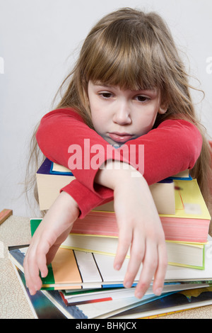 Is it possible to read all these books? little cute sad girl with a ...