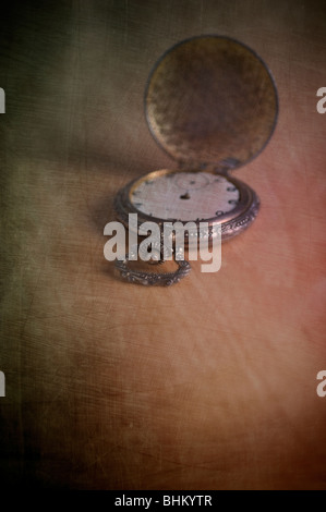 old pocket watch without hands on a white background Stock Photo - Alamy
