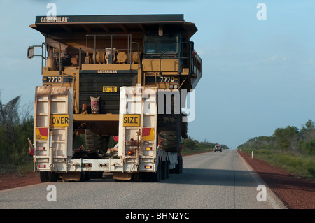 Heavy mining equipment being delivered to mine site on outback highway ...