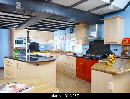 A modern kitchen in a period property, with a large island unit in the ...