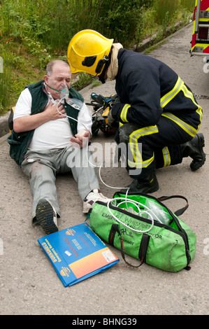 Fireman gives first aid to casualty - simulation Stock Photo: 28020764 ...
