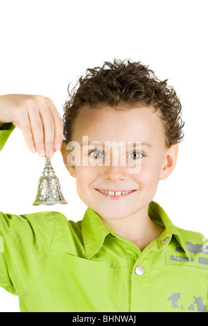 Cheerful boy ringing hand bell in front of him, blue background Stock ...