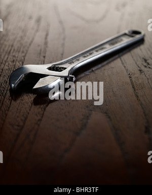 Adjustable spanner on a shiny light surface Stock Photo - Alamy