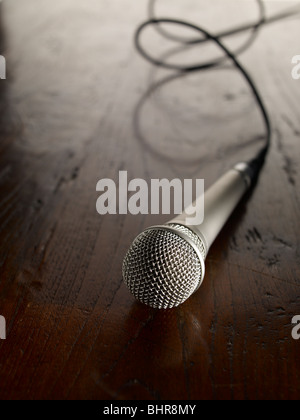 microphone on a stage floor table top Stock Photo - Alamy