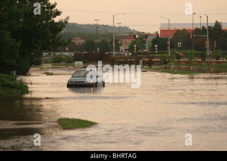 A car is stranded in flooded water from the River Anker on the ...