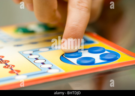 Funny board game played with colored buttons Stock Photo - Alamy
