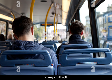 London bus interior view of passengers seated on upper deck of double ...