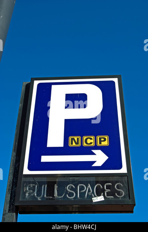 sign for ncp car park with right pointing arrow and letter P, in ...