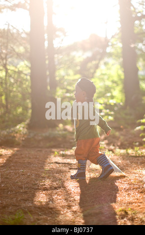 A young boy peeing in the woods Stock Photo - Alamy