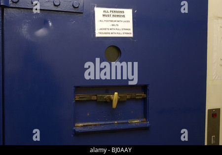 Police cell door showing instructions for inmates UK Stock Photo - Alamy