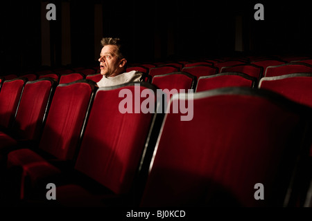 portrait of spectator watching theatre play Stock Photo - Alamy