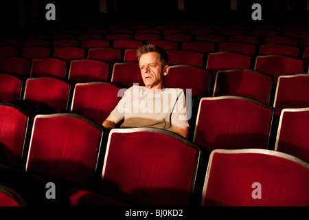 portrait of spectator watching theatre play Stock Photo - Alamy