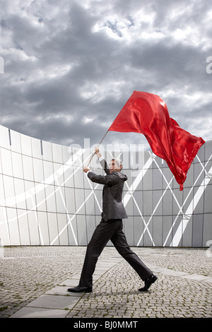 businessman waving red flag Stock Photo - Alamy