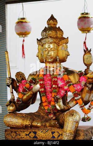 A golden shrine of a four-faced Brahma God Stock Photo - Alamy