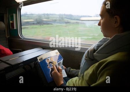 French woman passenger reading the TGV magazine inside a Train Grande ...