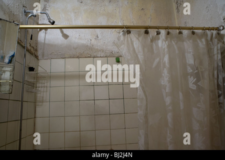 decaying shower in a run down bathroom Stock Photo - Alamy