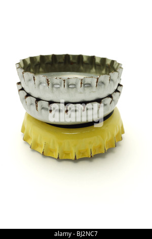 A stack of metal bottle caps isolated on white background Stock Photo ...