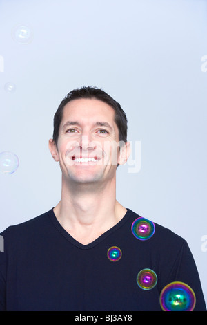 People around the bubble man Stock Photo - Alamy