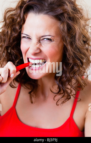lady with a chili Stock Photo - Alamy