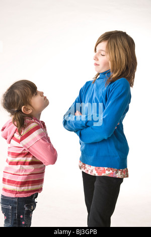 dispute of little kids girls fight with folders in classroom. Quarrel ...