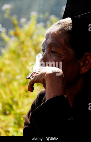 karen old lady at funeral smoking , pumpium refugee camp(thai burmese ...