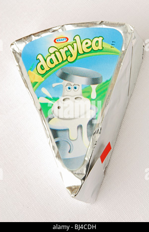 cheese triangles in foil on white Stock Photo - Alamy