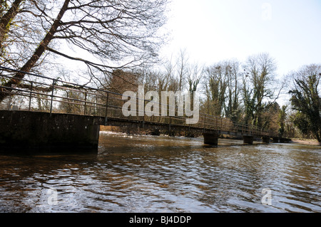 The Frome River and a bridge at Moreton Ford in Moreton, Dorset in the ...