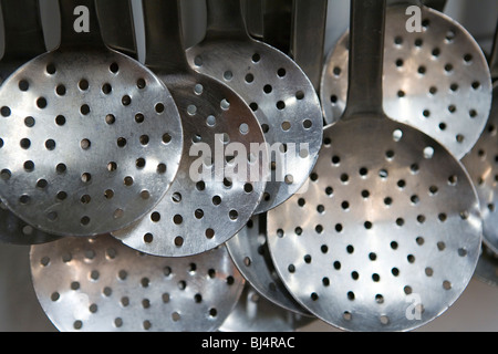 Skimming ladles in a commercial kitchen Stock Photo - Alamy