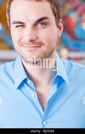 Happy smiling winking young man with thumbs up. Full body length ...