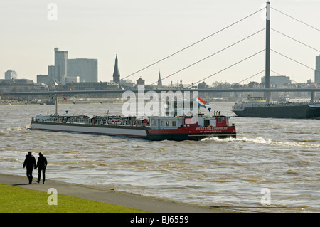 Barge on the Rhine with view of Oberkassel Bridge and Düsseldorf ...