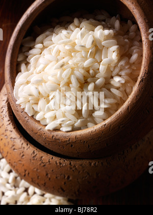 Raw Organic Carnaroli Rice in a Bowl on a gray background, top view ...