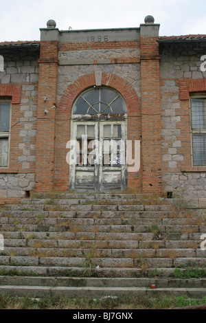 The main entrance with stairs of the abandoned old mansion called Dacha ...