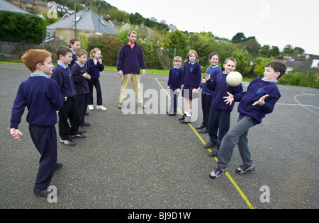 Traditional playground games being played on the school playground of a ...