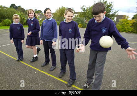 Traditional playground games being played on the school playground of a ...