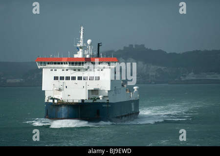 White Cliffs of Dover and a cargo ship and ferry moored along the ...