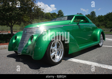A metallic-green Hot Rod with an oversized radiator grille, Warners ...