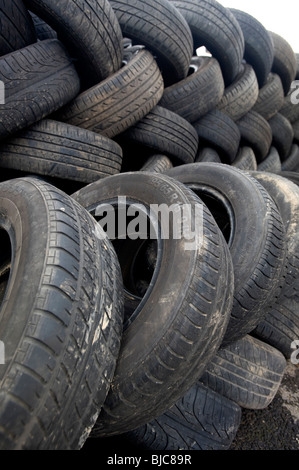 Waste car tyres stacked up in a pile waiting to be recycled Stock Photo ...