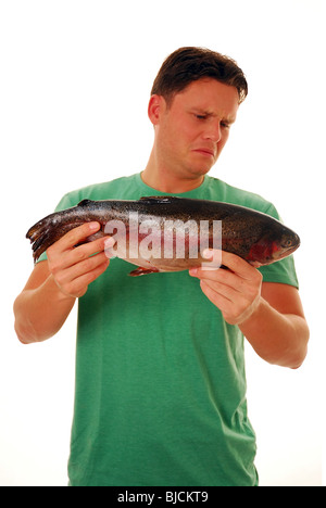 Man holding a large smelly fish Stock Photo - Alamy