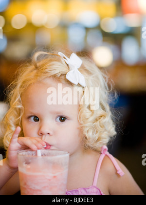 Baby drinking milkshake Stock Photo - Alamy