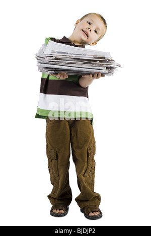 child holding a stack of newspapers Stock Photo - Alamy