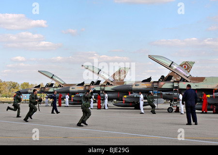 An Israeli pilot with a F-16 fighter jet in a hangar at Hatzor Israeli ...