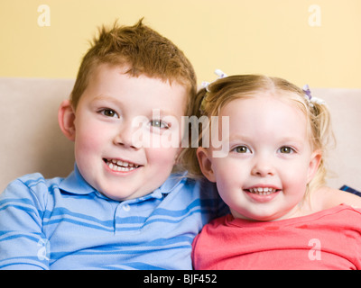 close up portrait of brother and sister hugging in autumnal park Stock ...