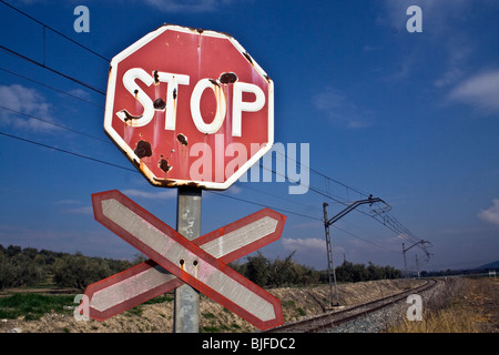 Stop sign at level crossing without barriers Stock Photo - Alamy